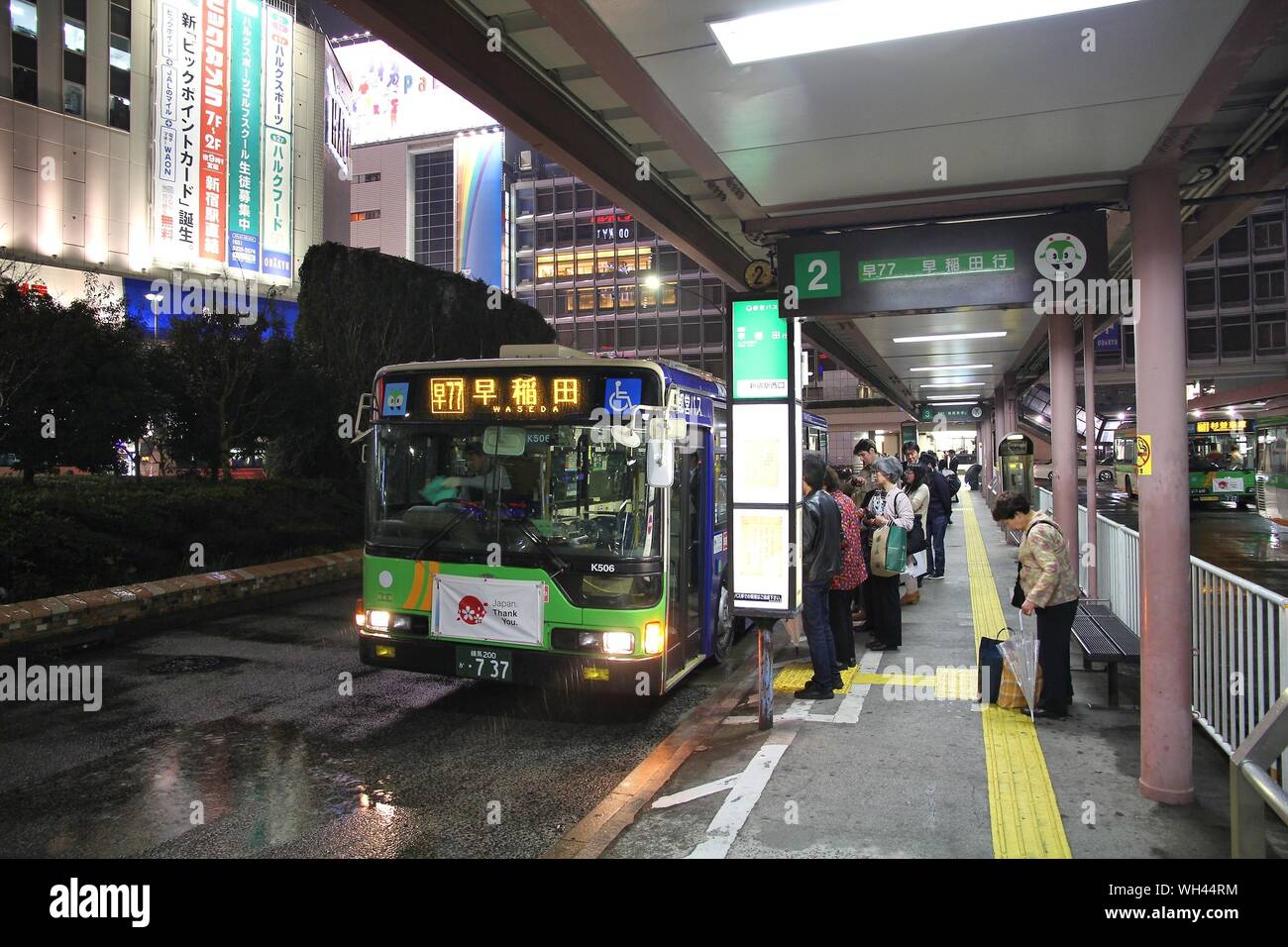 TOKYO, JAPAN - APRIL 13, 2012: People board Toei Bus in Shinjuku, Tokyo ...