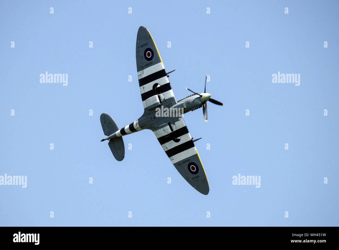 Supermarine Spitfire XV fighter flying, airplane on blue sky, view from ...