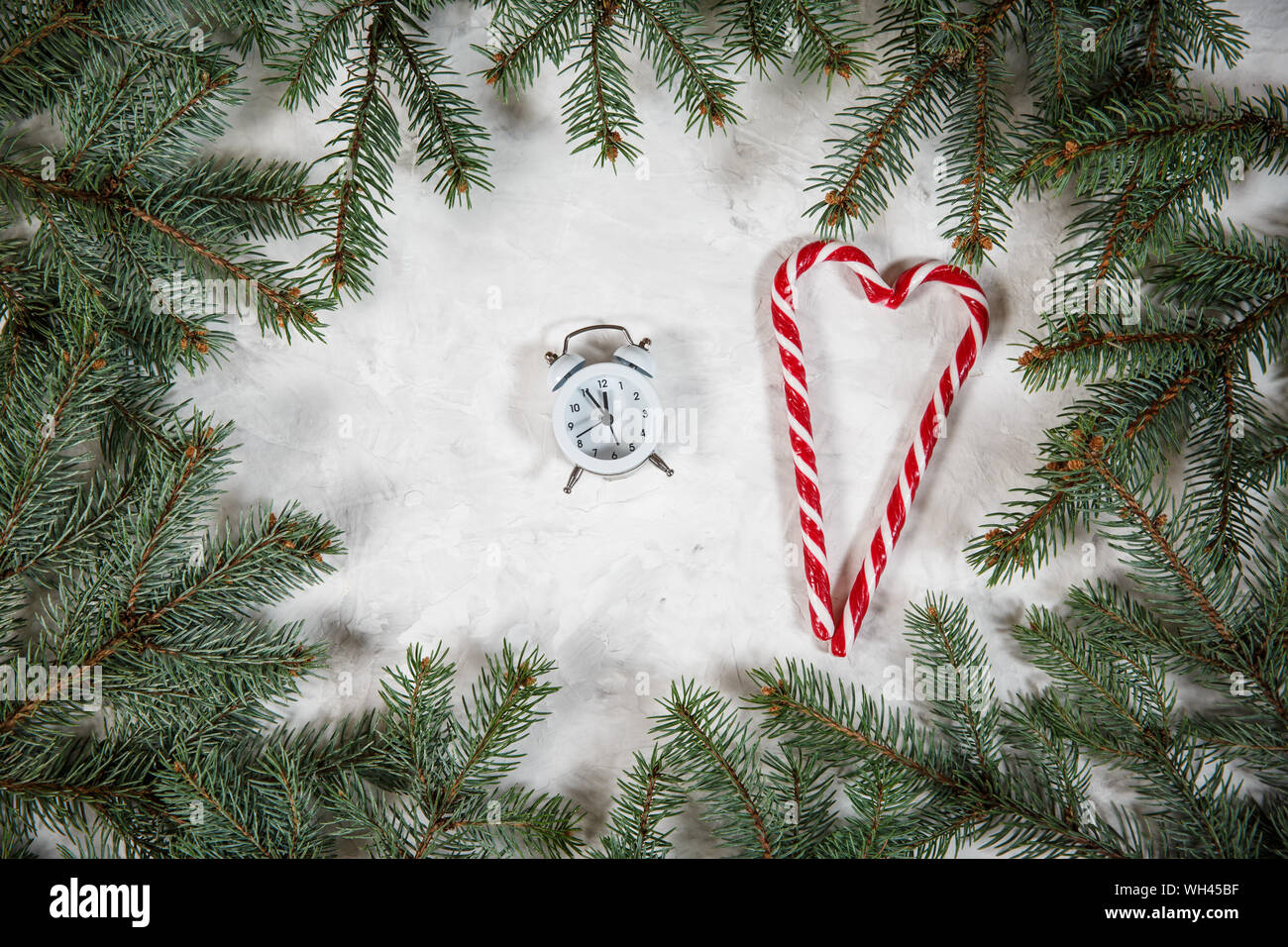 Christmas holiday background with vintage alarm-clock, Candy canes ...