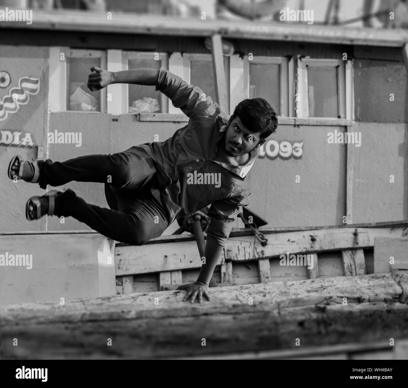Young man jumping over railing hi-res stock photography and images - Alamy