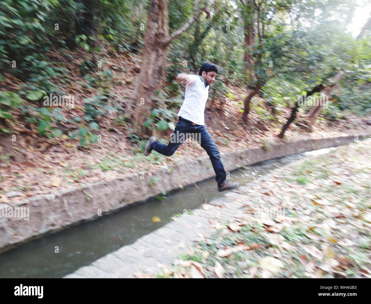 Jumping over trees hi-res stock photography and images - Alamy