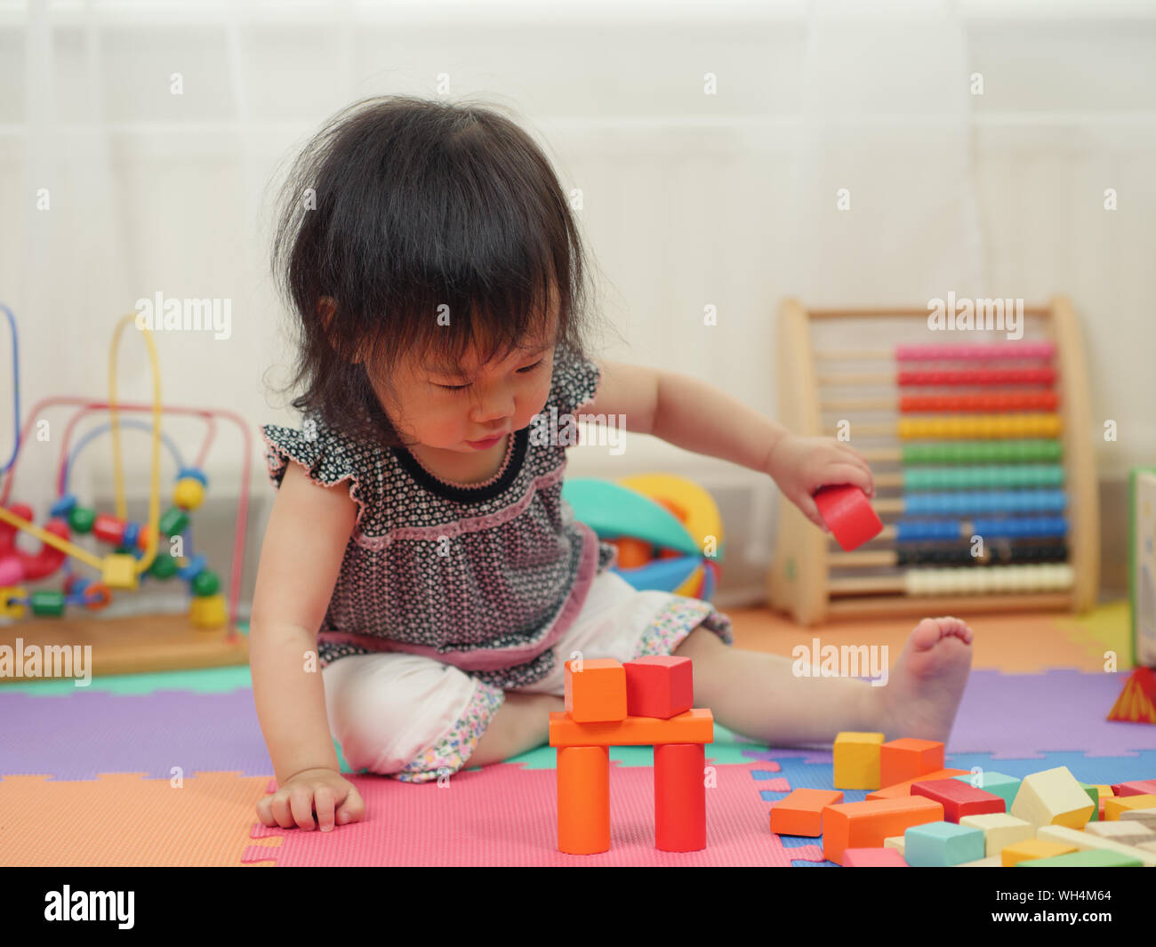 Baby girl with blocks people hi-res stock photography and images - Alamy
