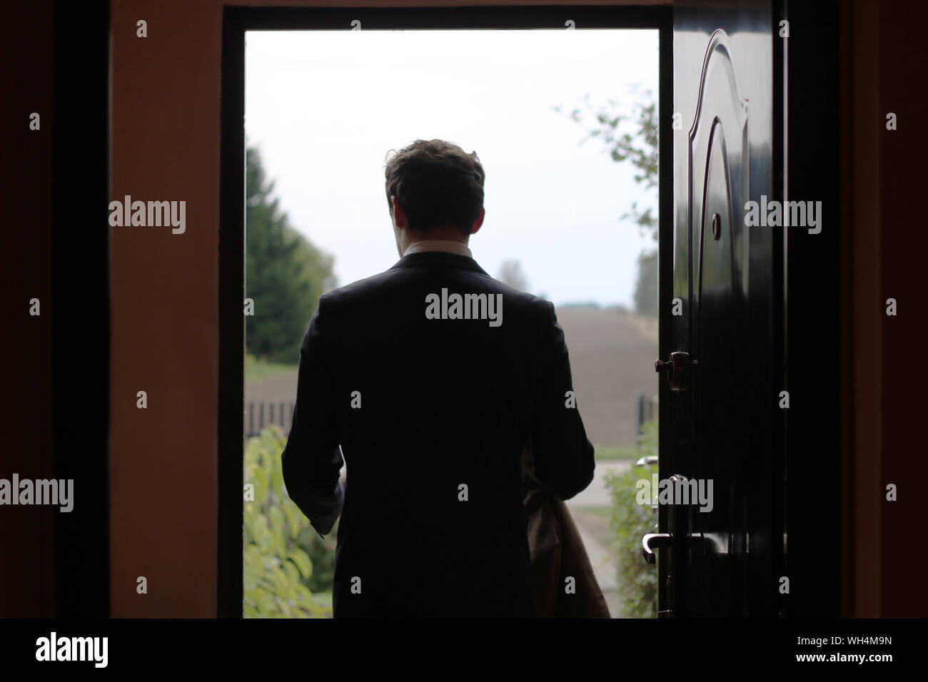 Man exiting door hi-res stock photography and images - Alamy