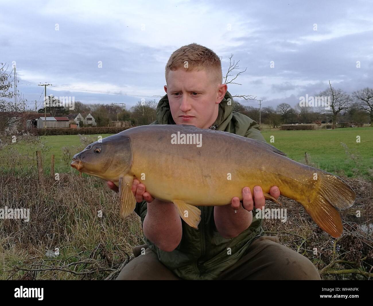 Man holding dead fish hi-res stock photography and images - Alamy