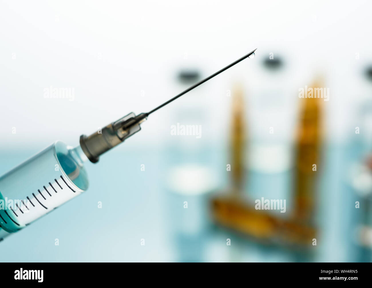 Close up Syringe needle medicine with liquid medicine drop Stock Photo ...