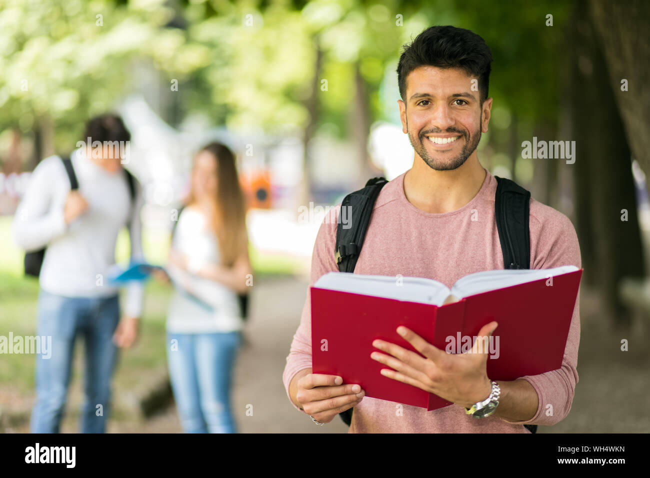 Happy students outdoor smiling Stock Photo - Alamy