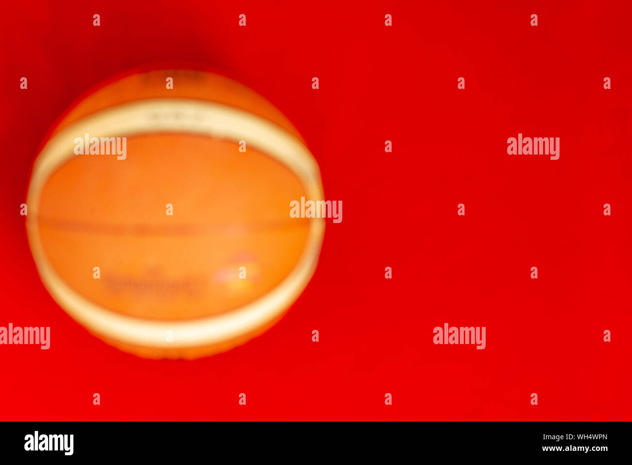 A blurry basket ball isolated with a red background Stock Photo - Alamy