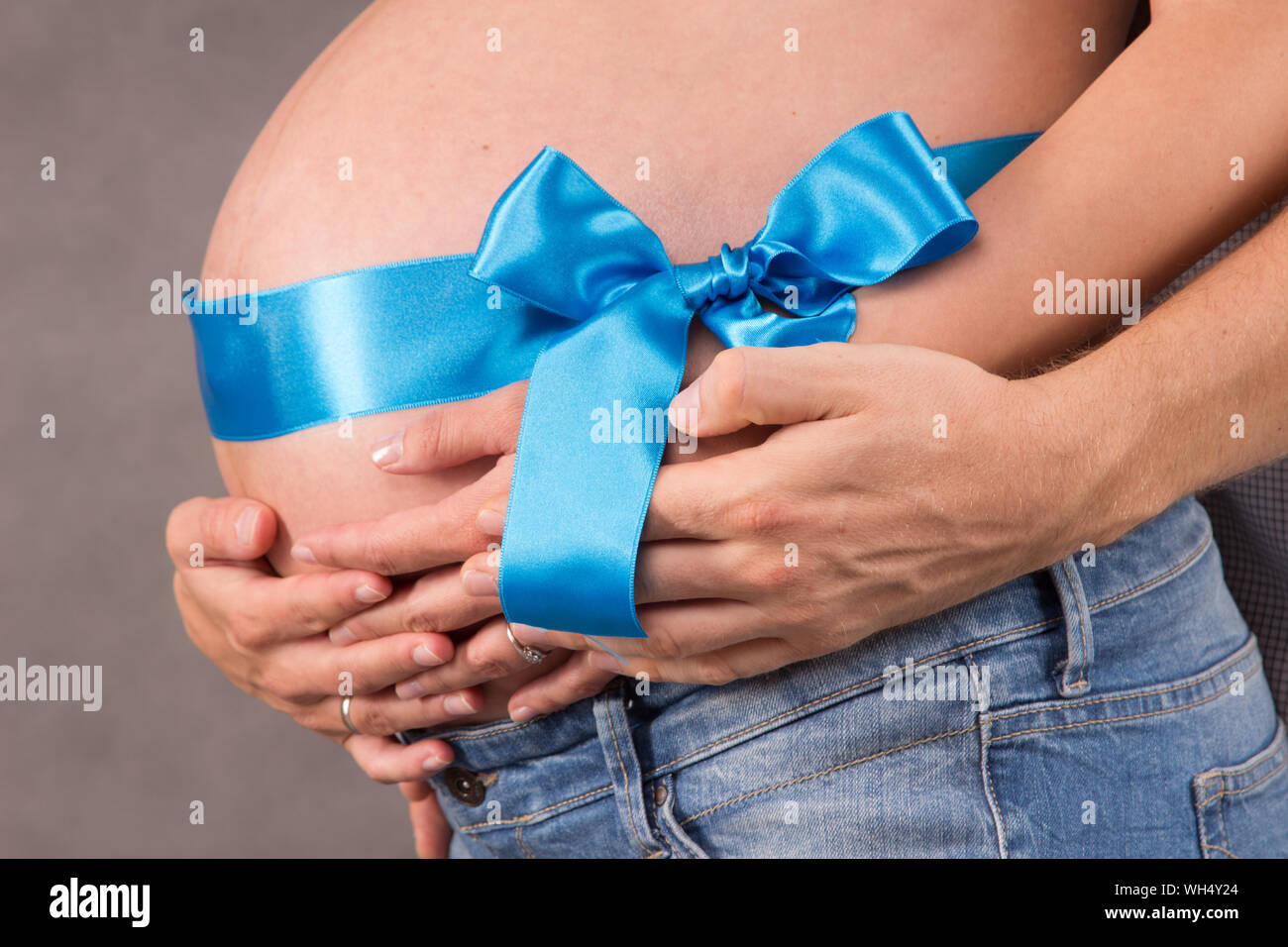 Pregnant belly and bow hi-res stock photography and images - Alamy