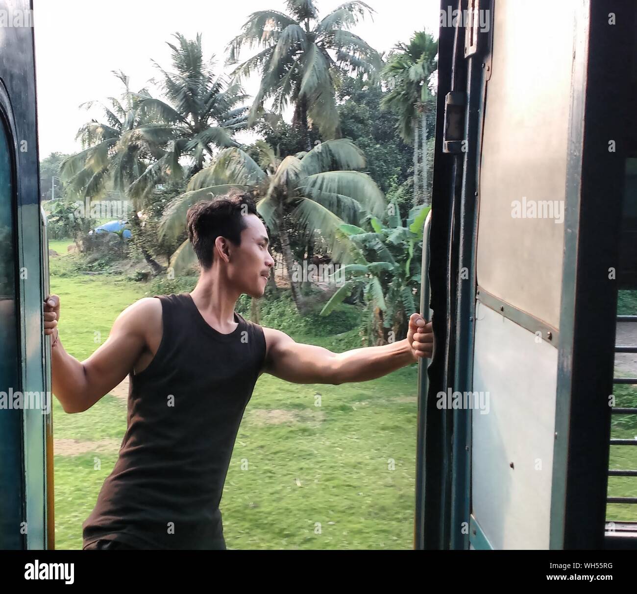 Man standing on train hi-res stock photography and images - Alamy