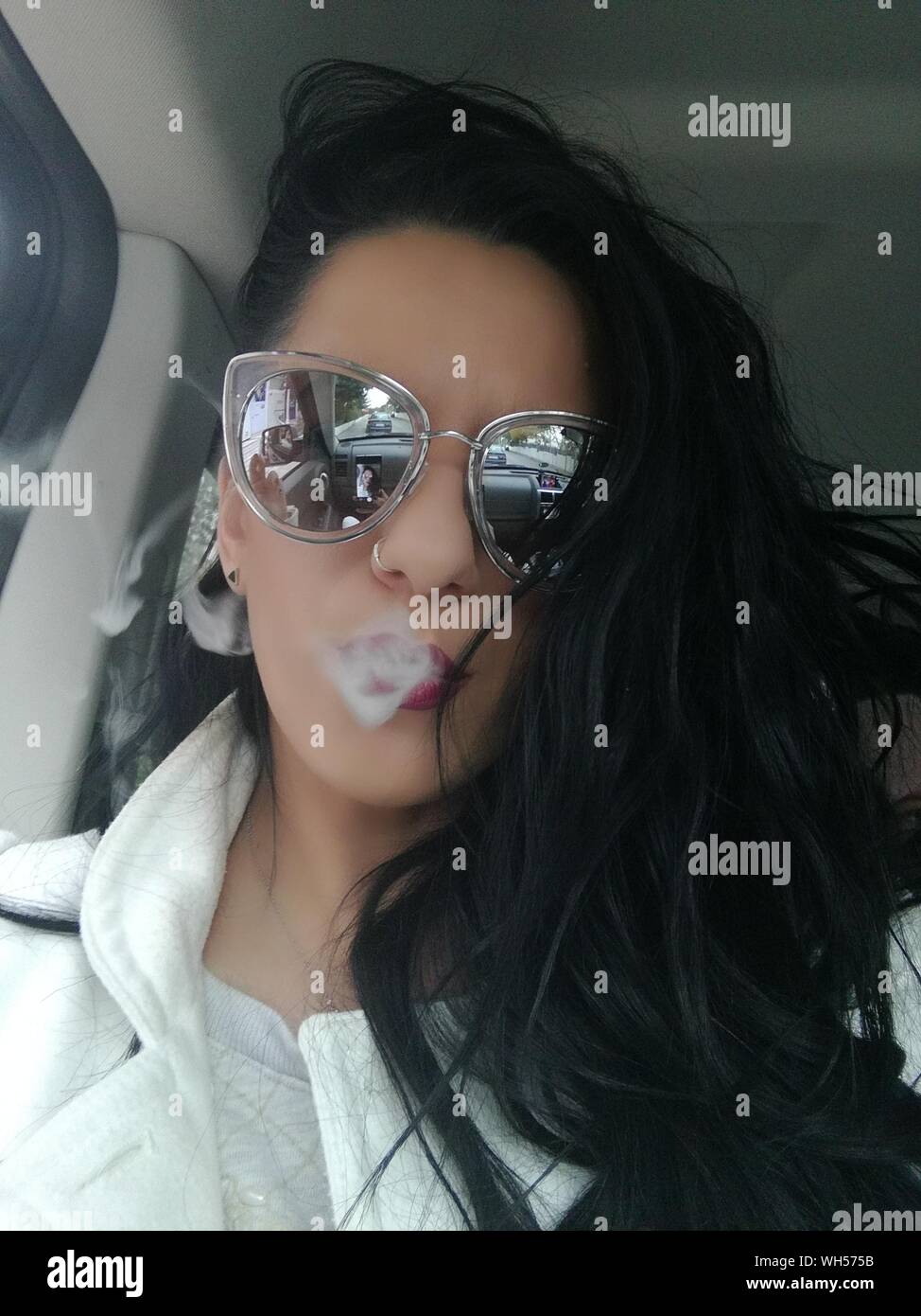 Adult smoking in car hi-res stock photography and images - Alamy