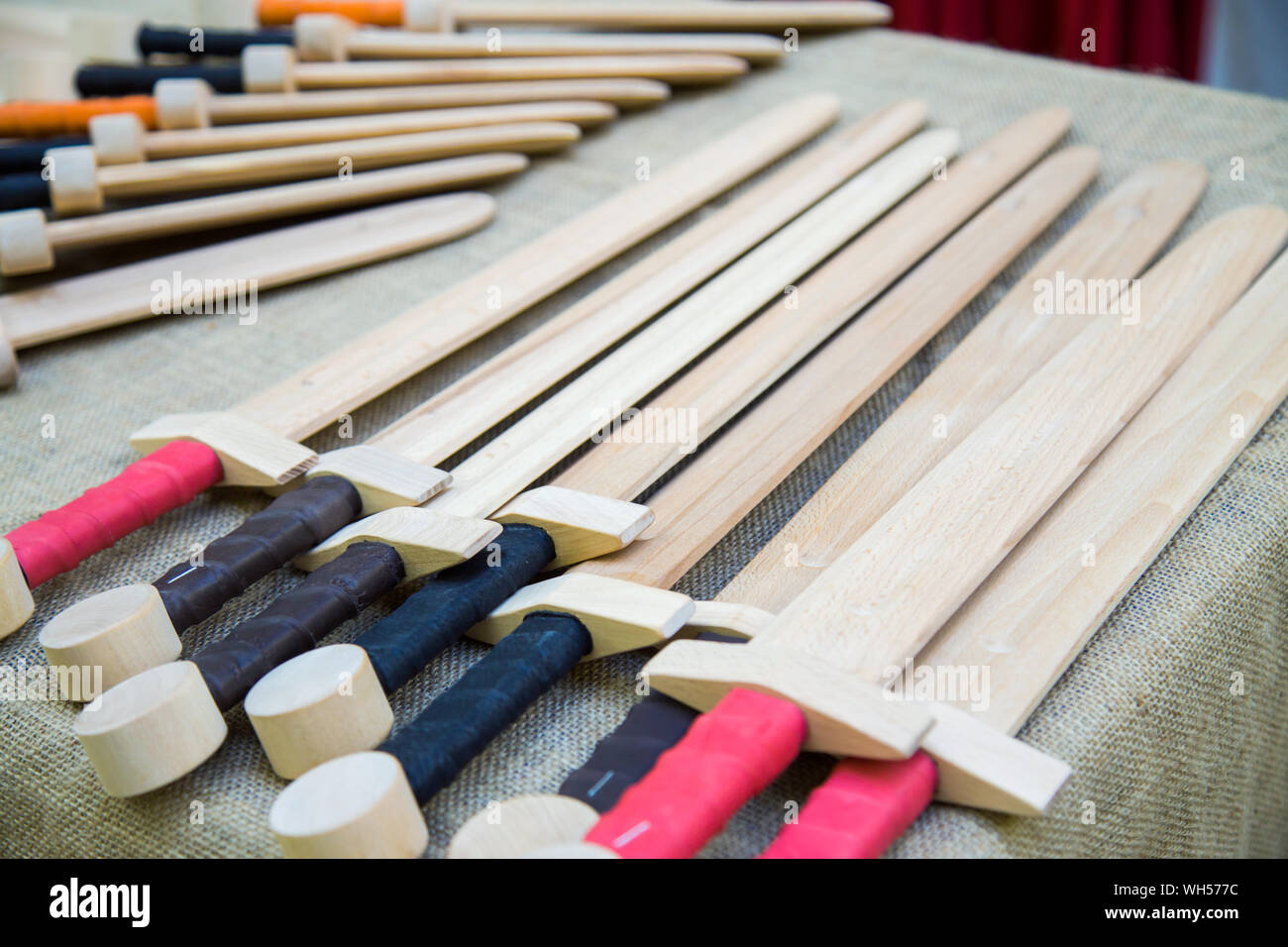 Handmade wooden toy swords Stock Photo - Alamy