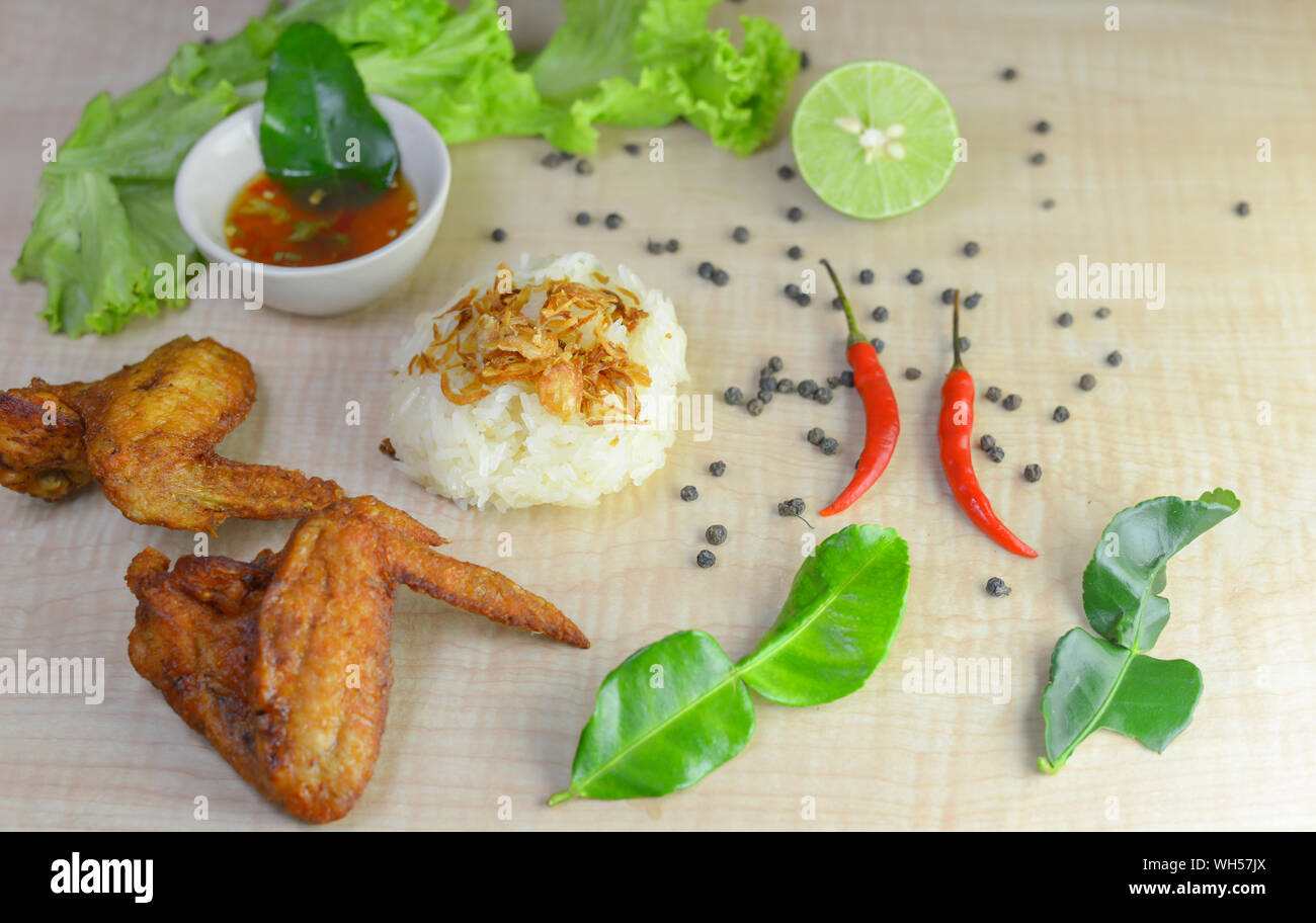 Chicken Wing With Rice On Table Stock Photo - Alamy