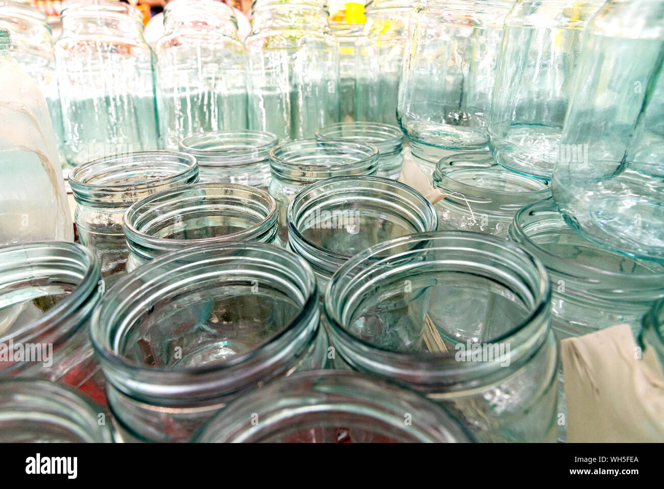 Lots of empty transparent jars in rows background Stock Photo - Alamy Lots of empty transparent jars in rows background Stock Photo - Alamy