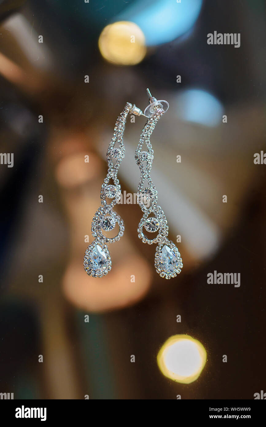Hanging earrings hi-res stock photography and images - Alamy