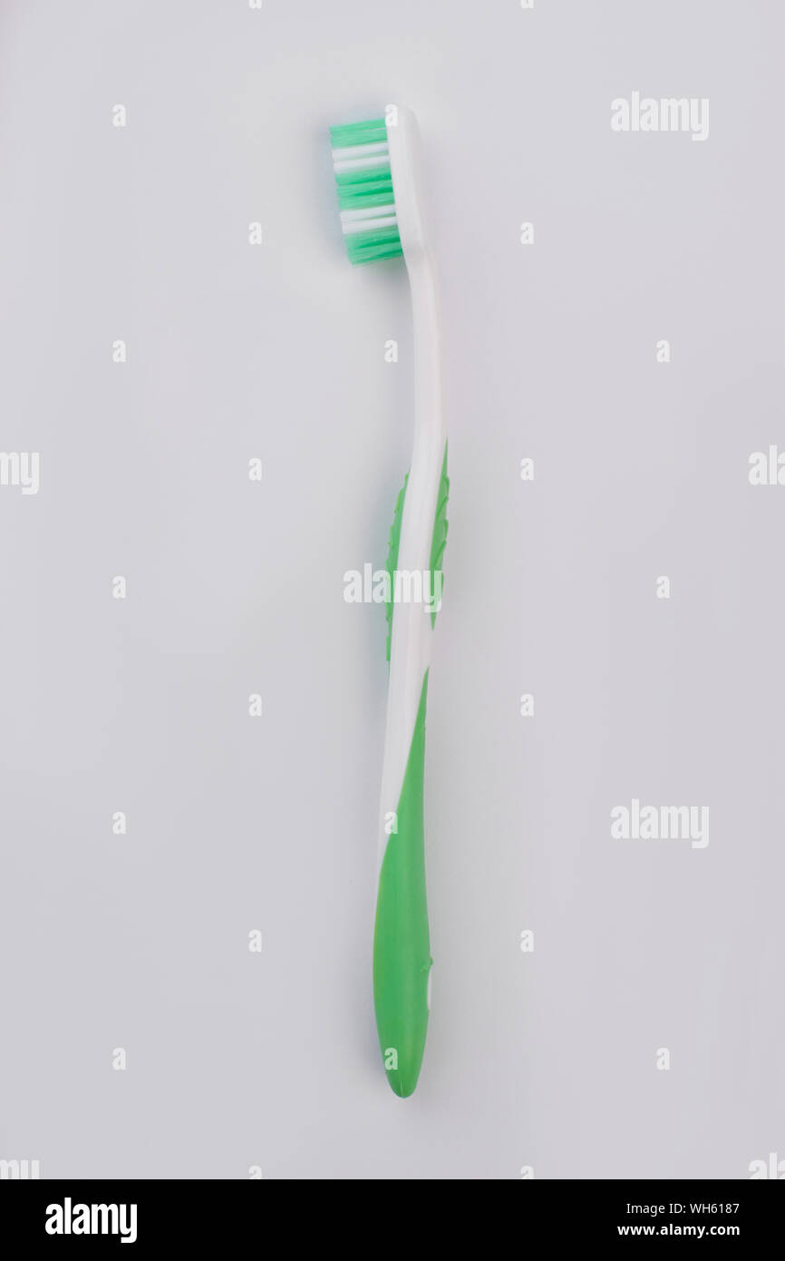 Green tooth brush isolated on white background Stock Photo - Alamy
