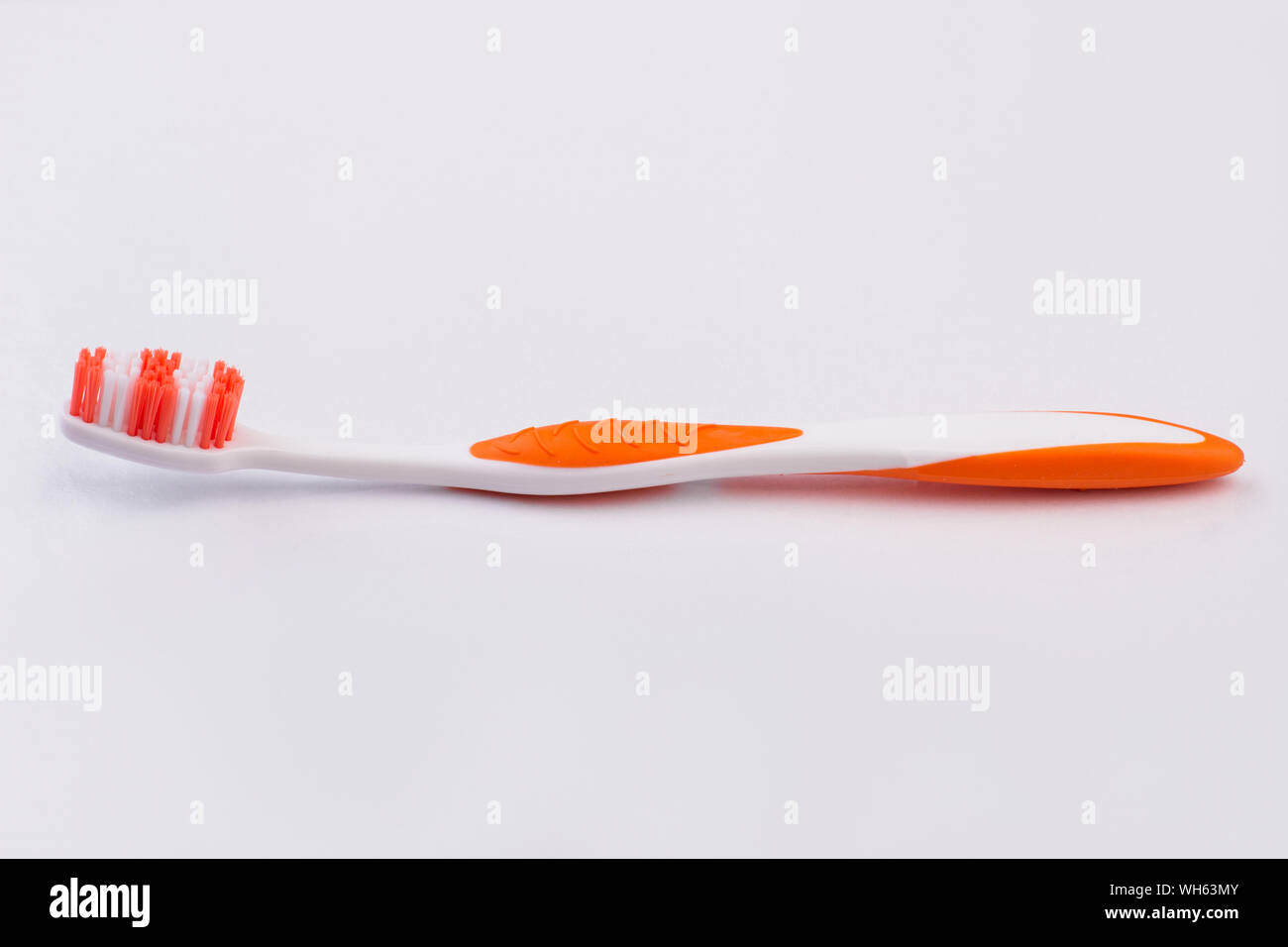 New plastic toothbrush isolated on white background Stock Photo - Alamy