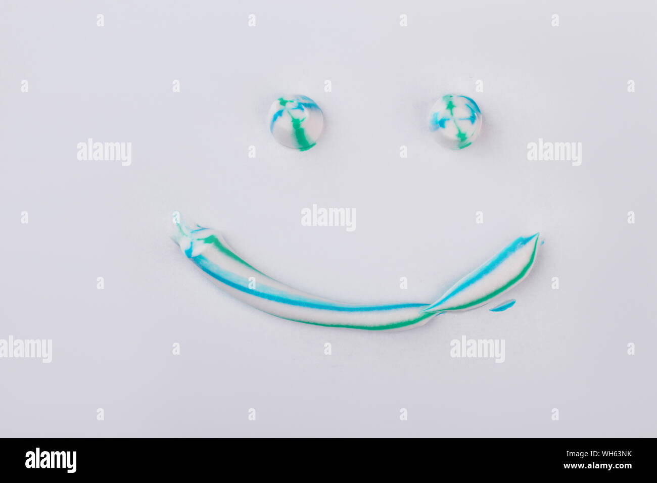 Toothpaste in a shape of face with smile Stock Photo - Alamy