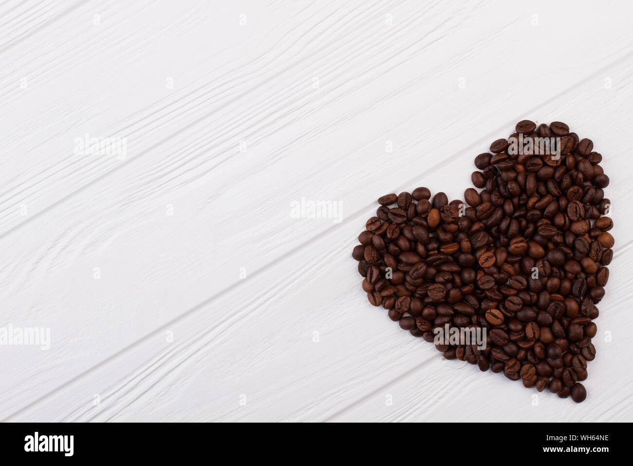 Coffee beans in heart shape Stock Photo - Alamy