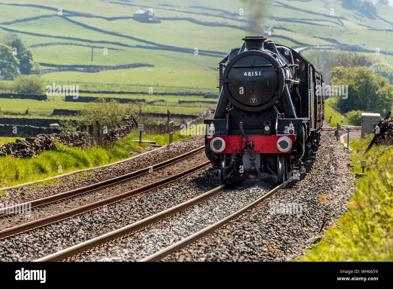 The LMS Class 8F, 2-8-0 48151, steam train passing through Ribblesdalel ...