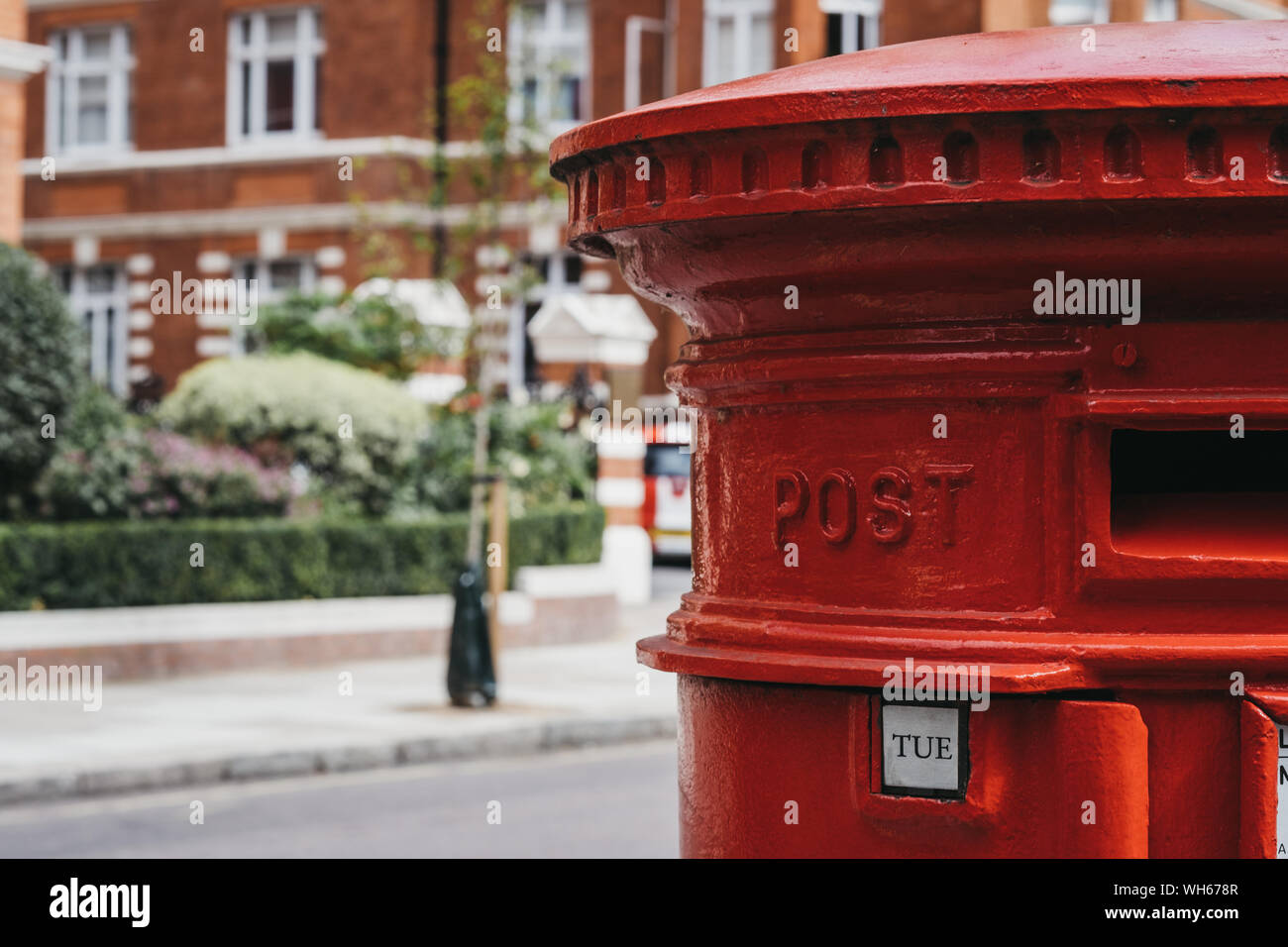 Red british post box in a city street hi-res stock photography and ...