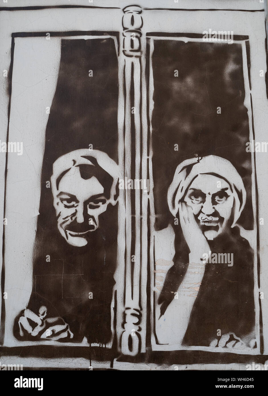 Man and his wife staring out the window Stock Photo - Alamy