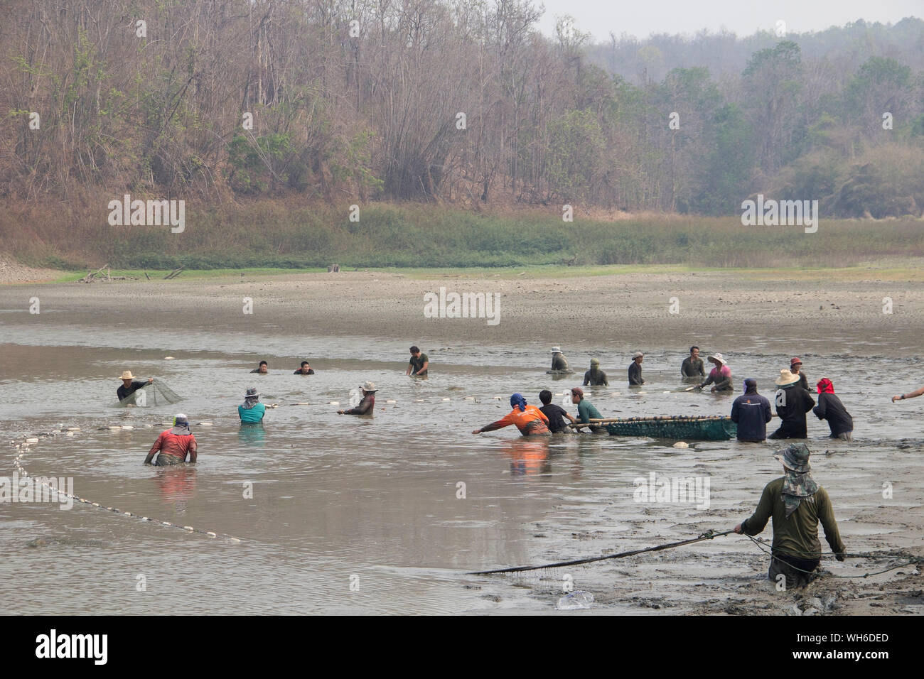 Group of people fishing with net hi-res stock photography and images ...
