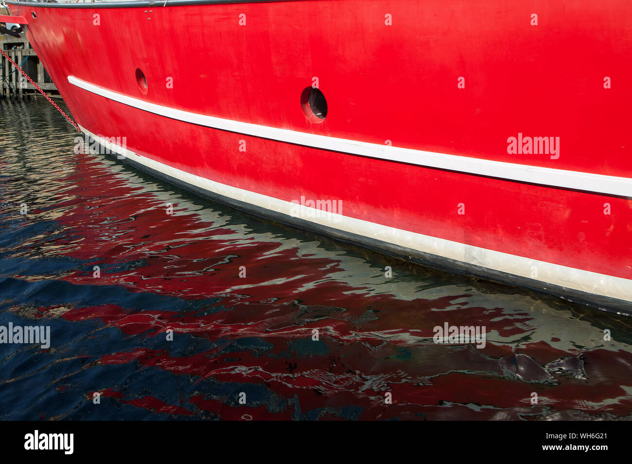 side view of red boat Stock Photo - Alamy