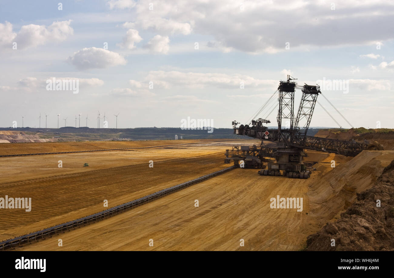 Giant bucket wheel excavator taking away the layers of ground before ...