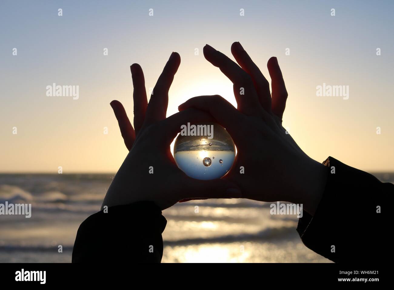 Holding ball in hands hi-res stock photography and images - Alamy
