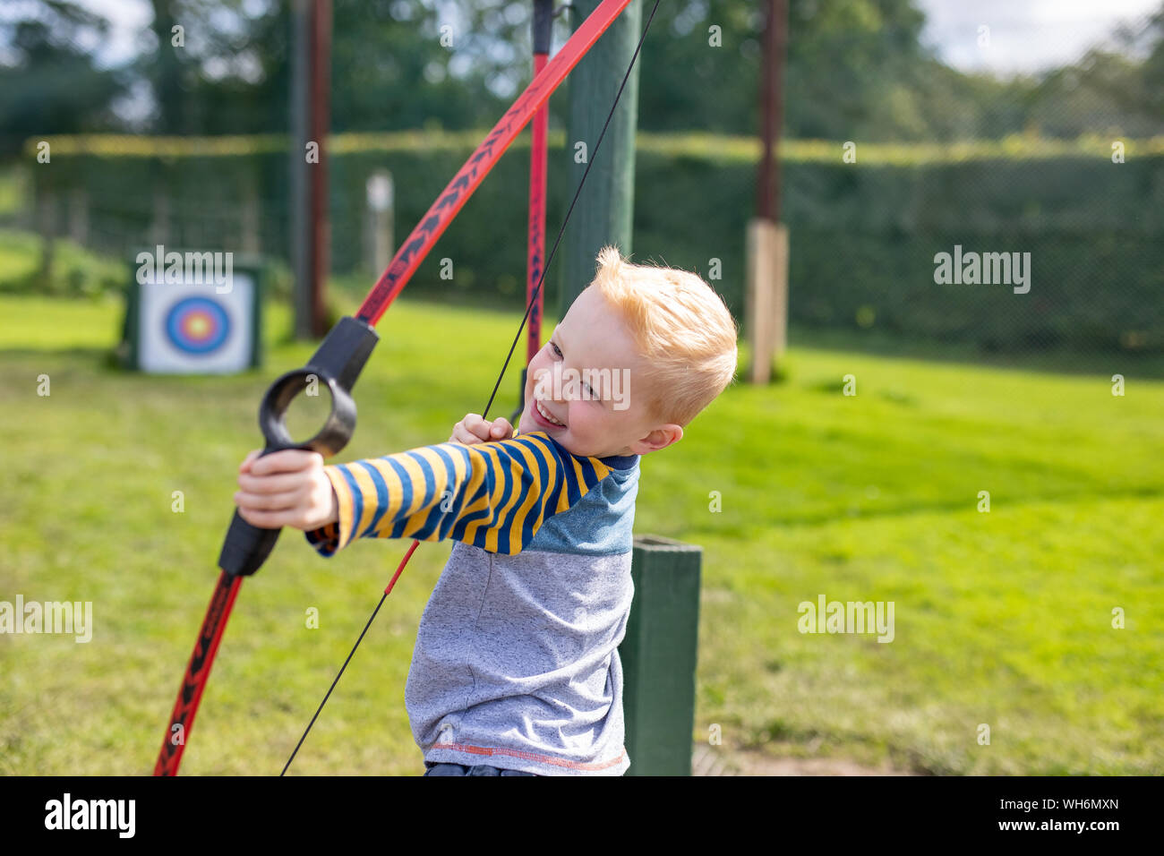 Boy with bow hi-res stock photography and images - Alamy
