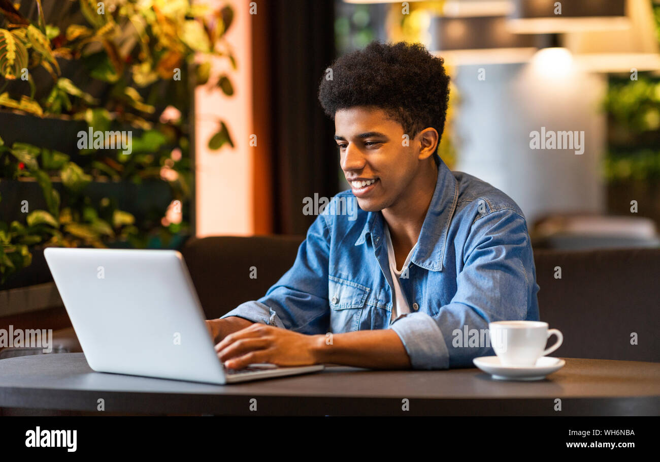 African Teenager Computer Typing High Resolution Stock Photography and ...