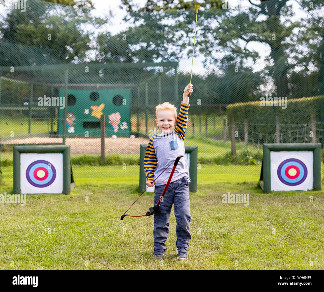 Boy learning to shoot hi-res stock photography and images - Alamy