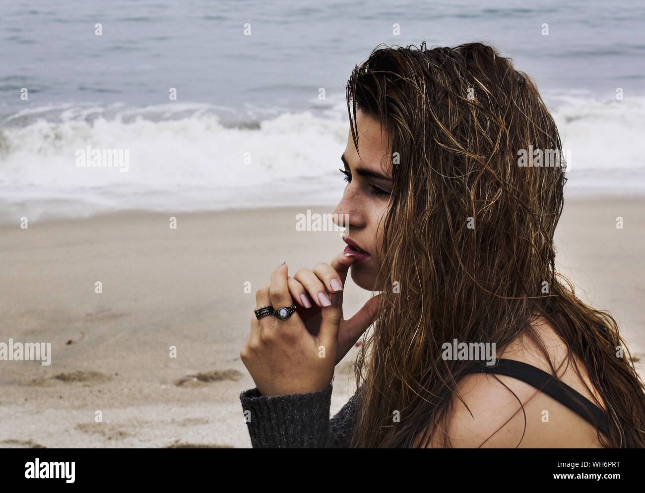 One young woman beach thinking hi-res stock photography and images - Alamy