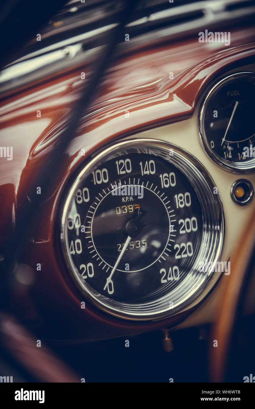 Color close up shot of a blue speedometer on a vintage car's dashboard ...