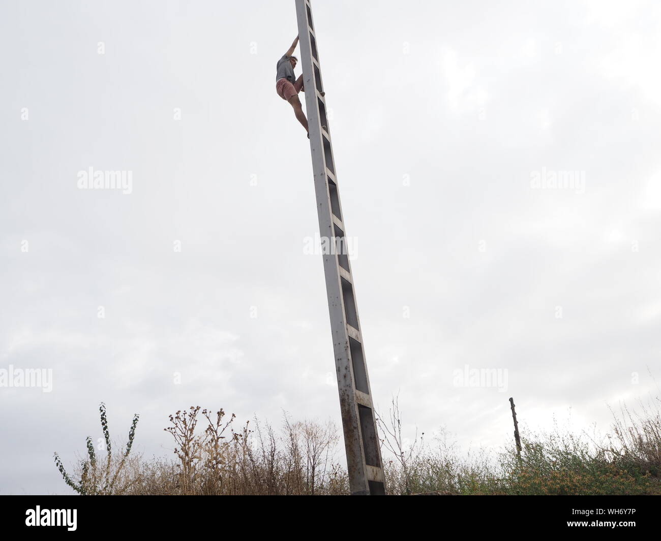 Man and ladder hi-res stock photography and images - Alamy