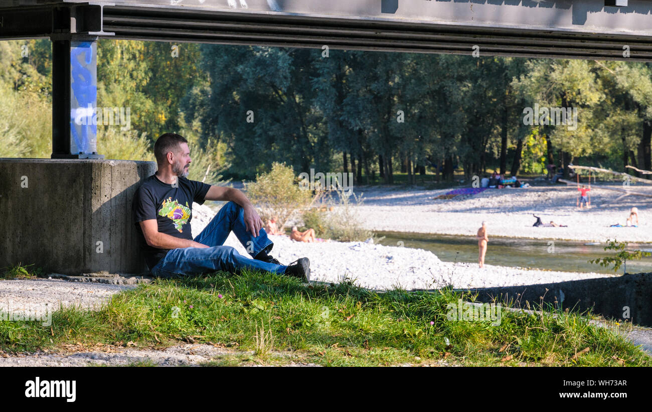 Man sitting under bridge hi-res stock photography and images - Alamy