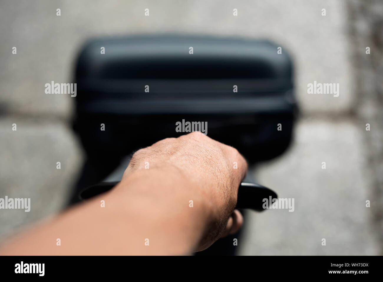 Man pulling trolley hi-res stock photography and images - Alamy