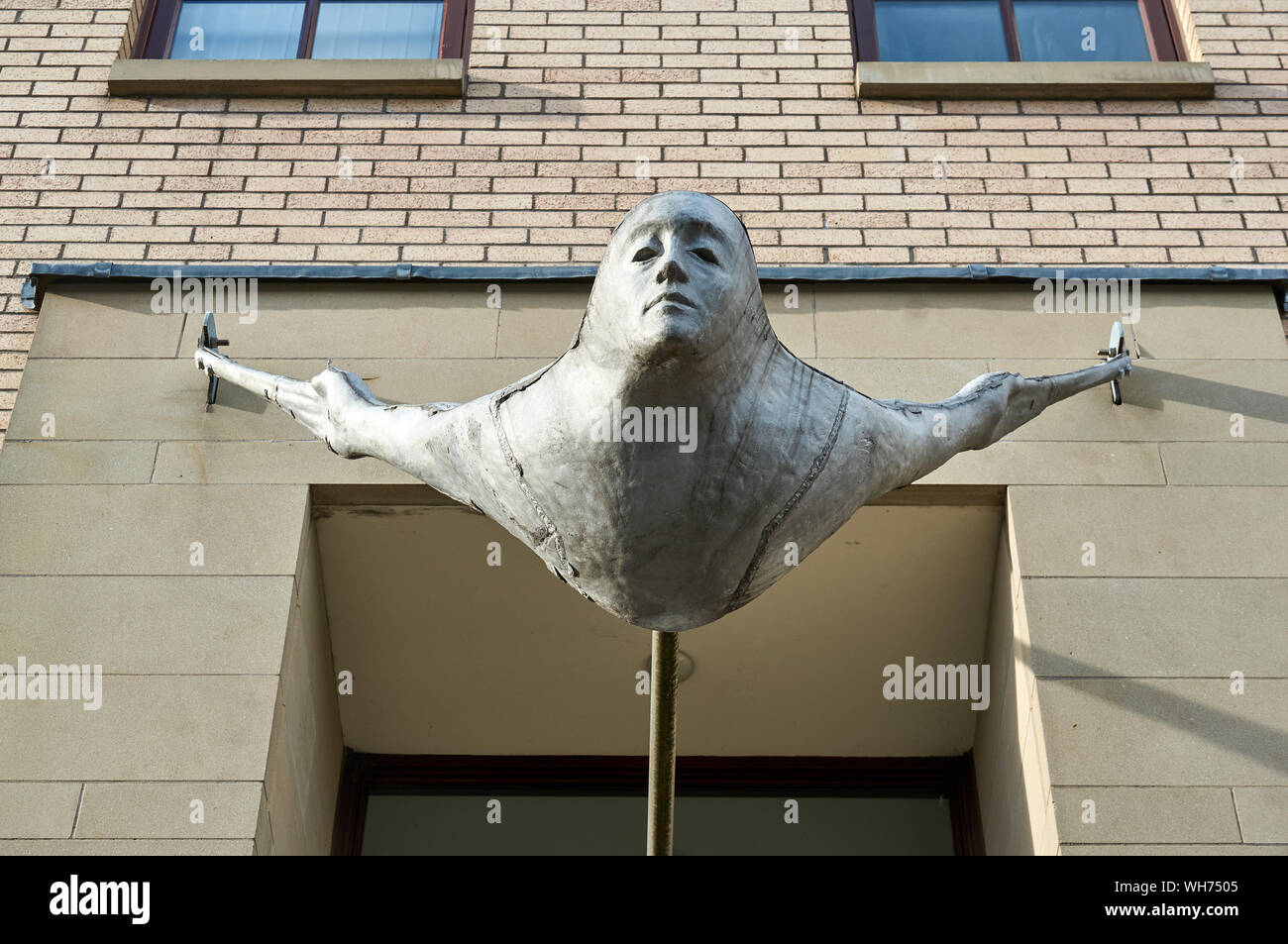 The Attendant head sculpture hanging over the doorways to modern ...