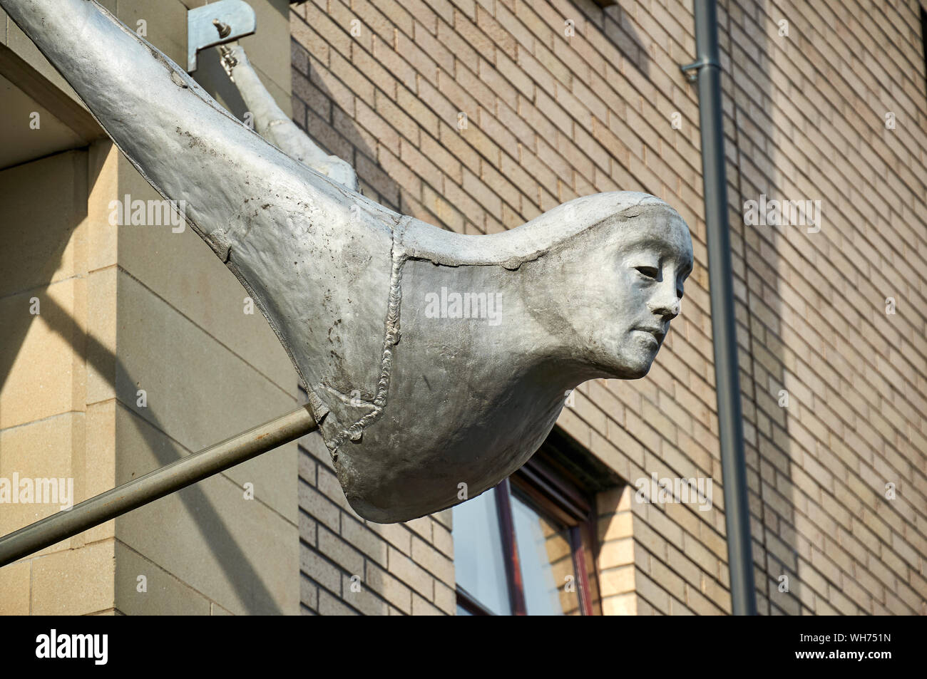 The Attendant head sculpture hanging over the doorways to modern ...