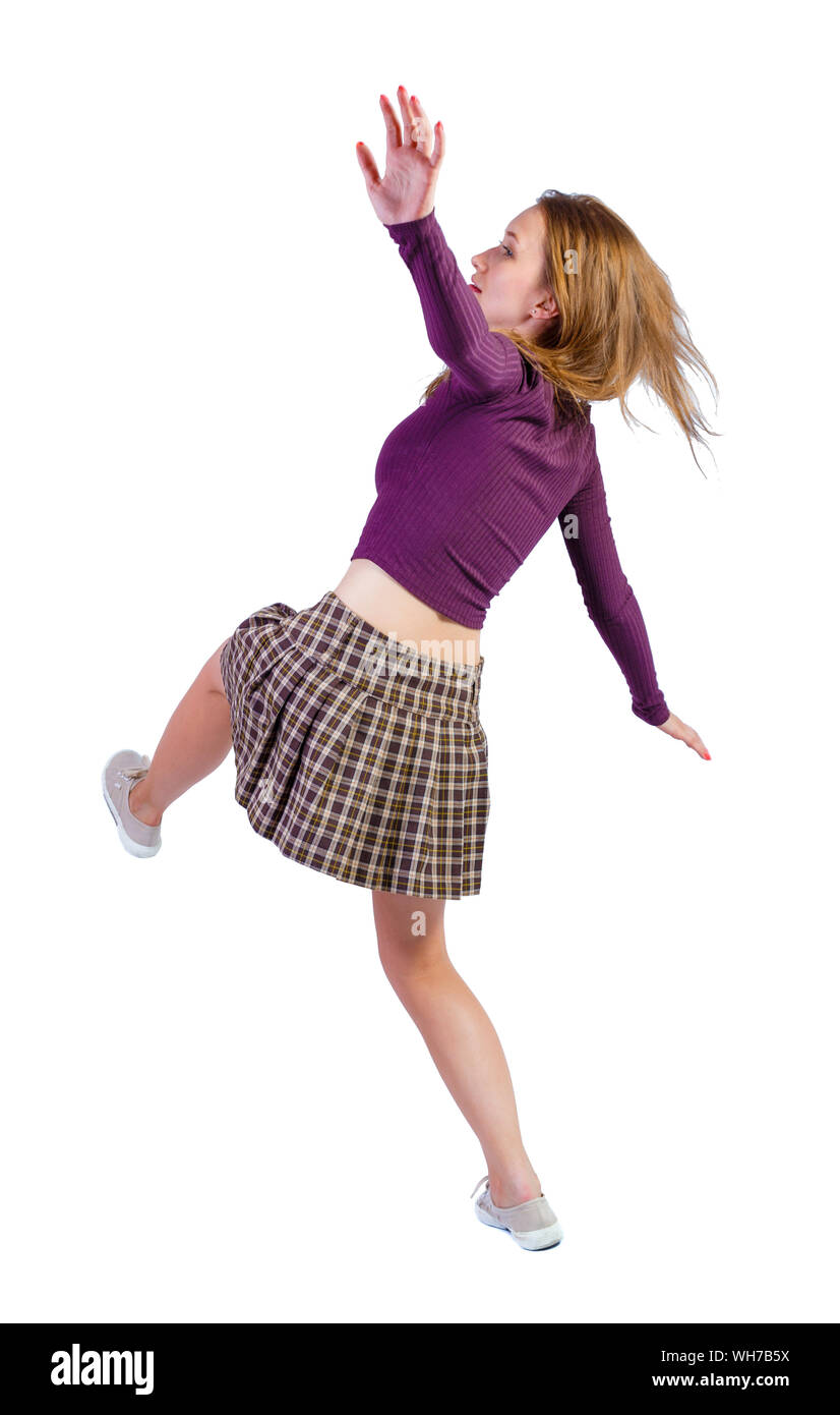 Back view of the falling girl. the girl slipped. Rear view people ...