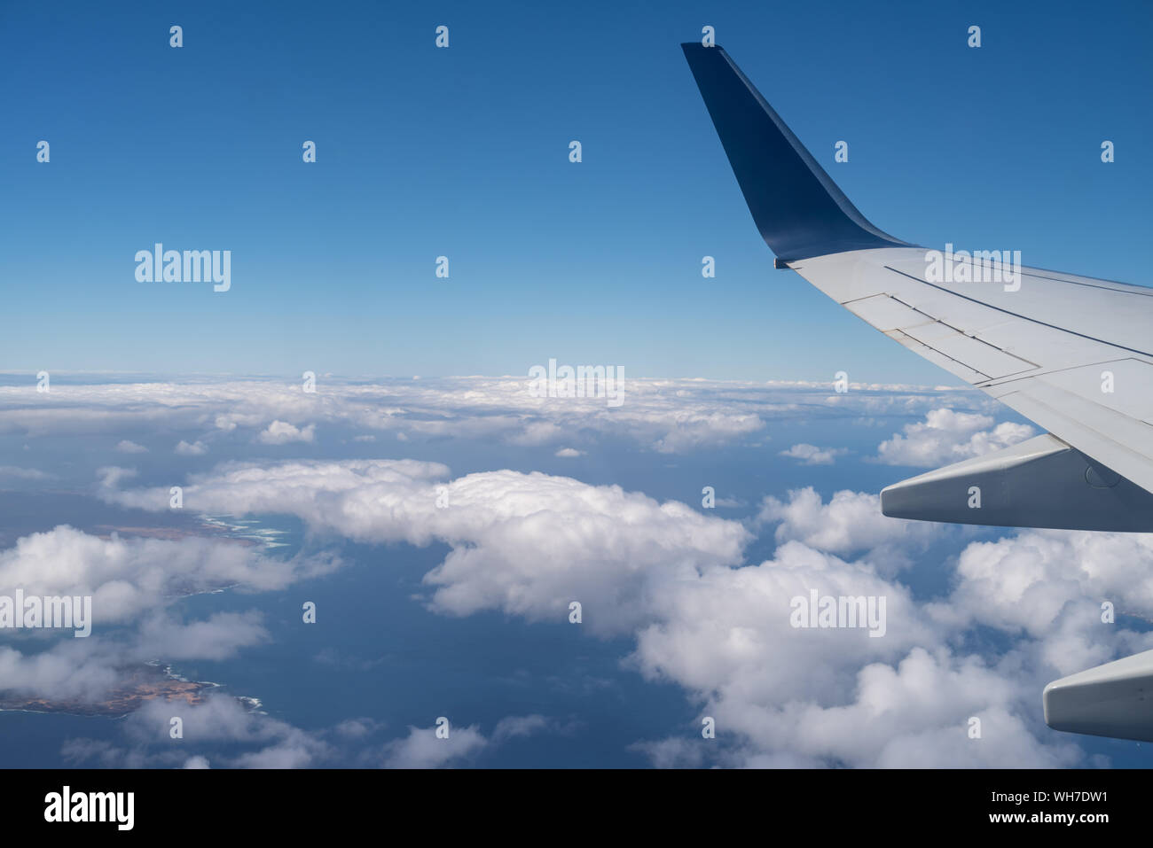 Plane wing from inside an airplane Stock Photo - Alamy