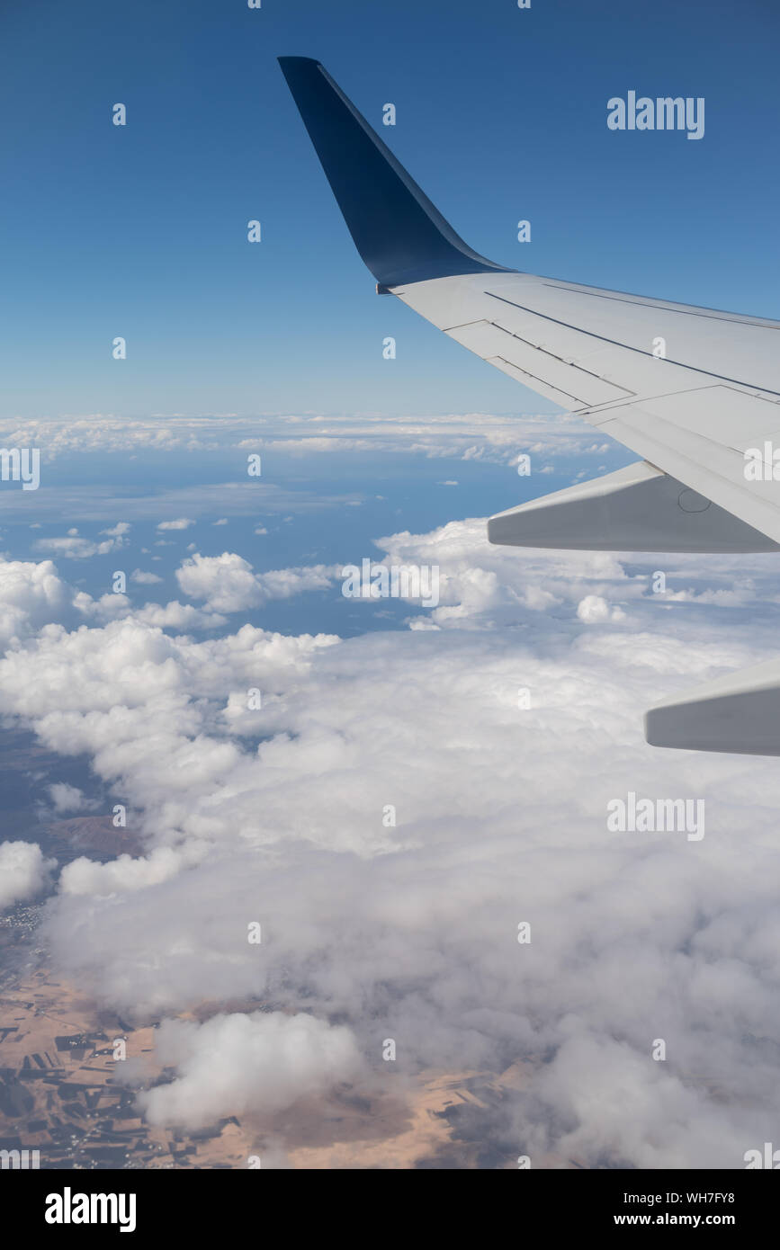 Plane wing from inside an airplane Stock Photo - Alamy