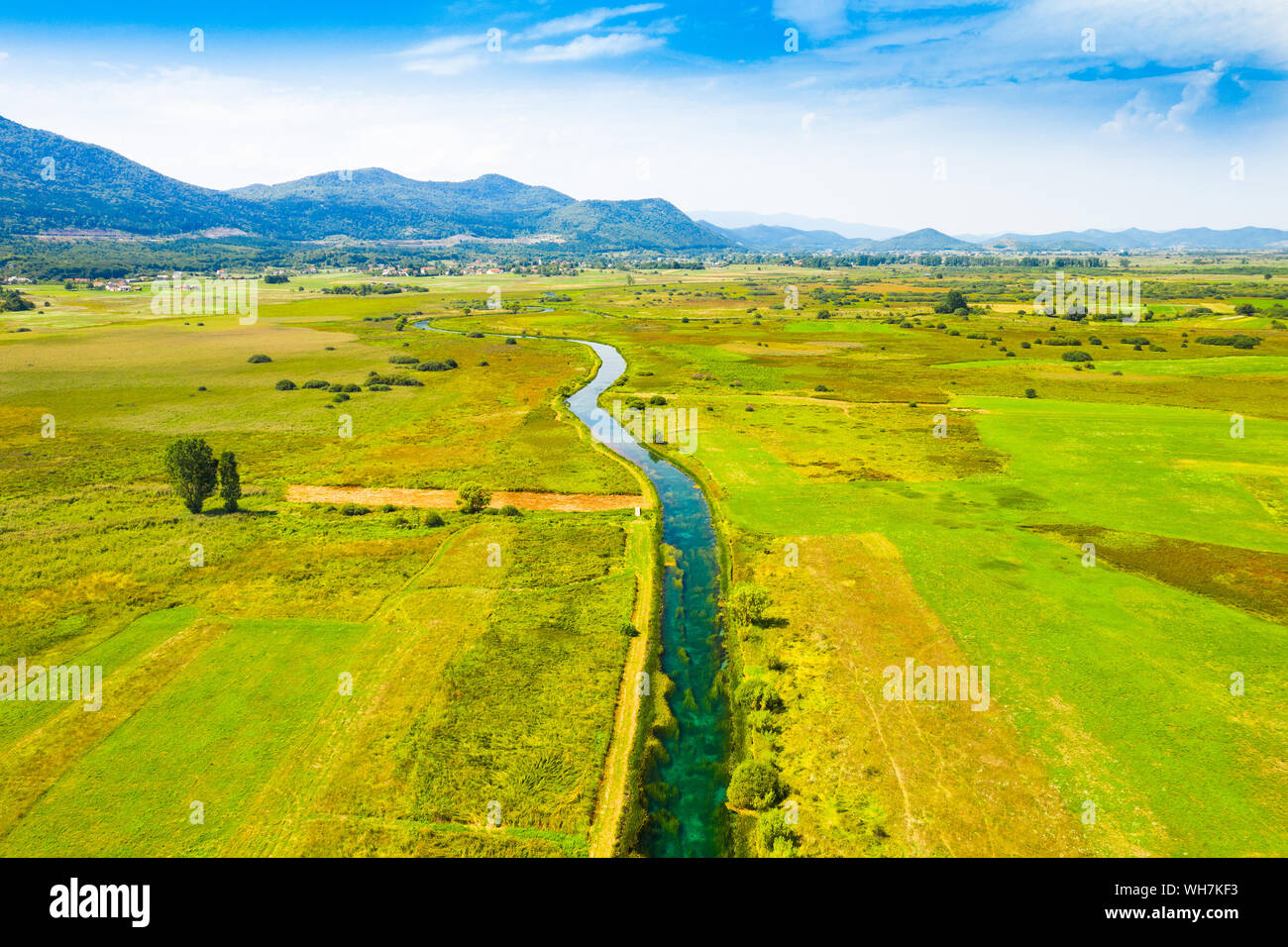 Beautiful nature landscape, Gacka river among grass banks, Lika region ...