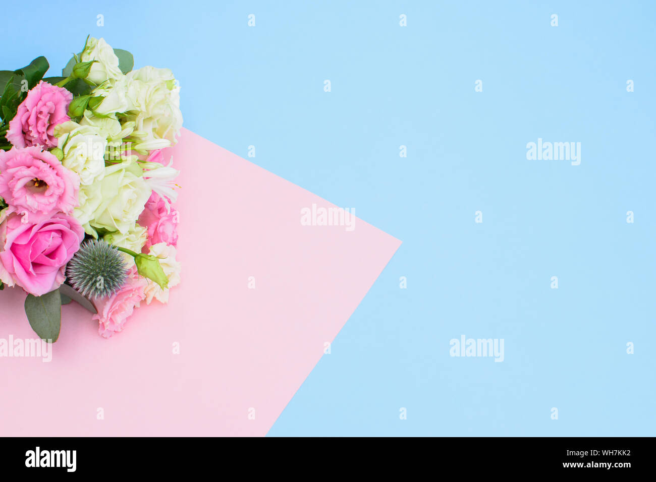 Colorful beautiful bouquet of different fresh flowers on the light blue ...