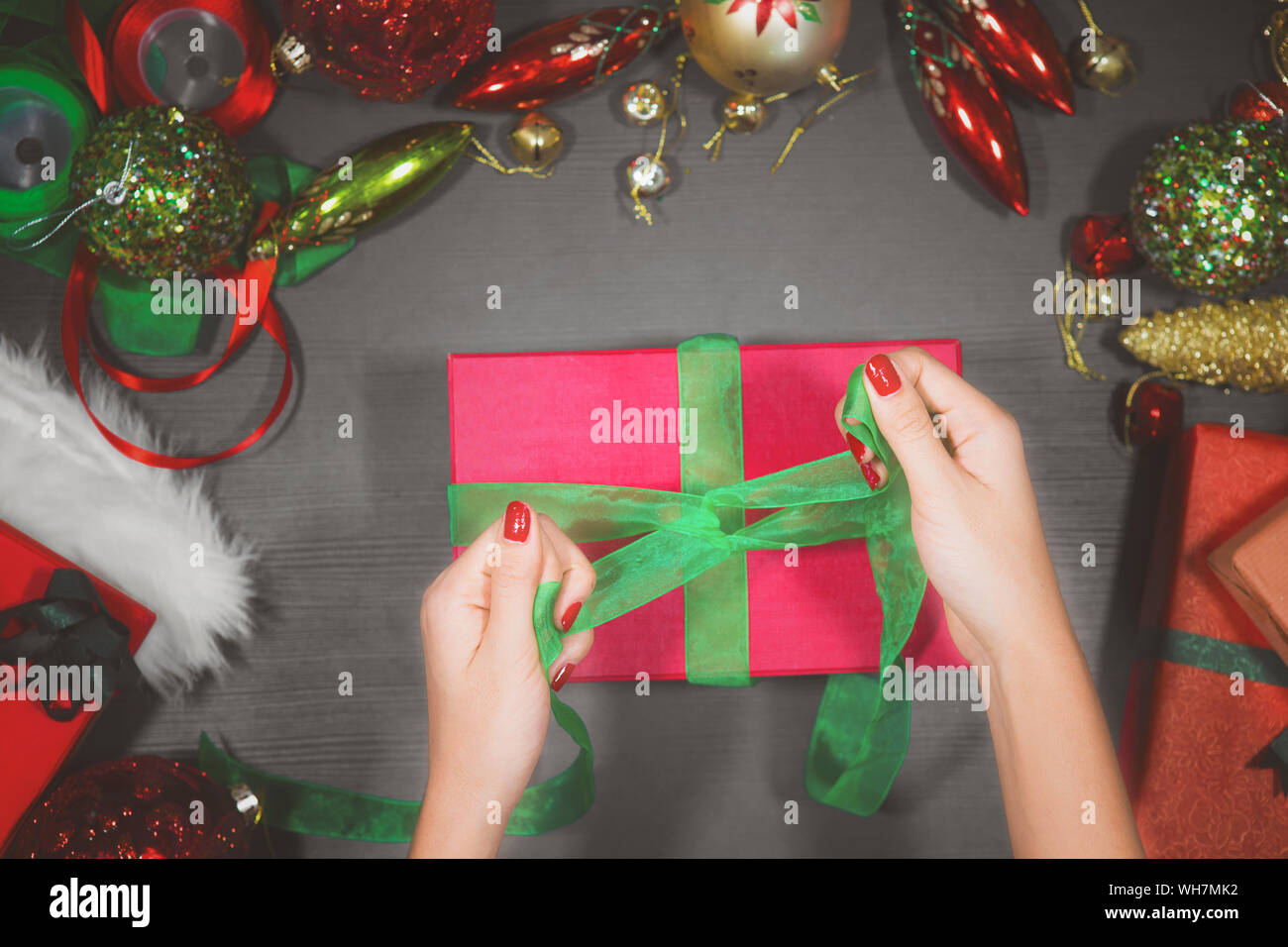 Woman hands tied up ribbon hi-res stock photography and images - Alamy