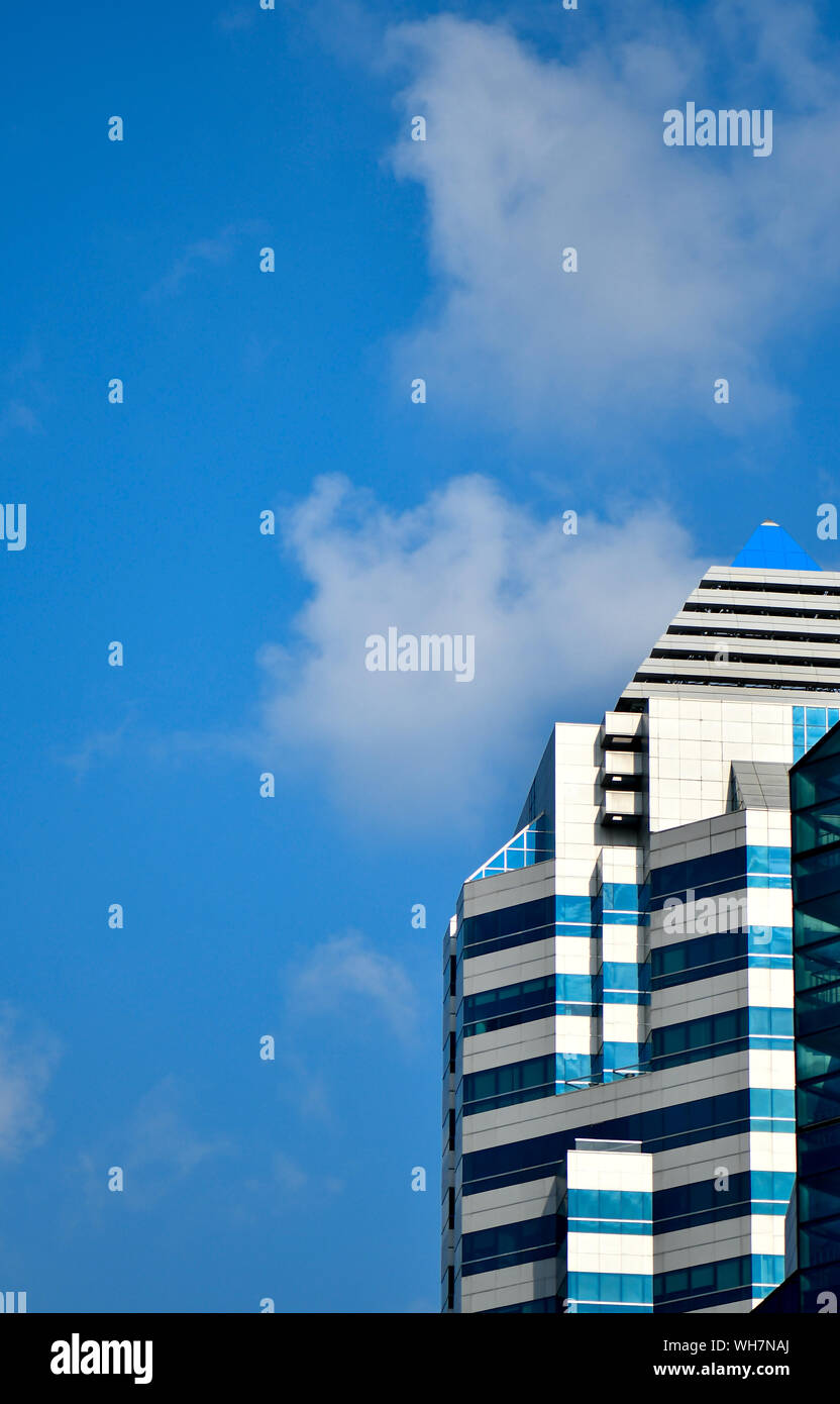 Blue and White building with blue sky background Stock Photo - Alamy