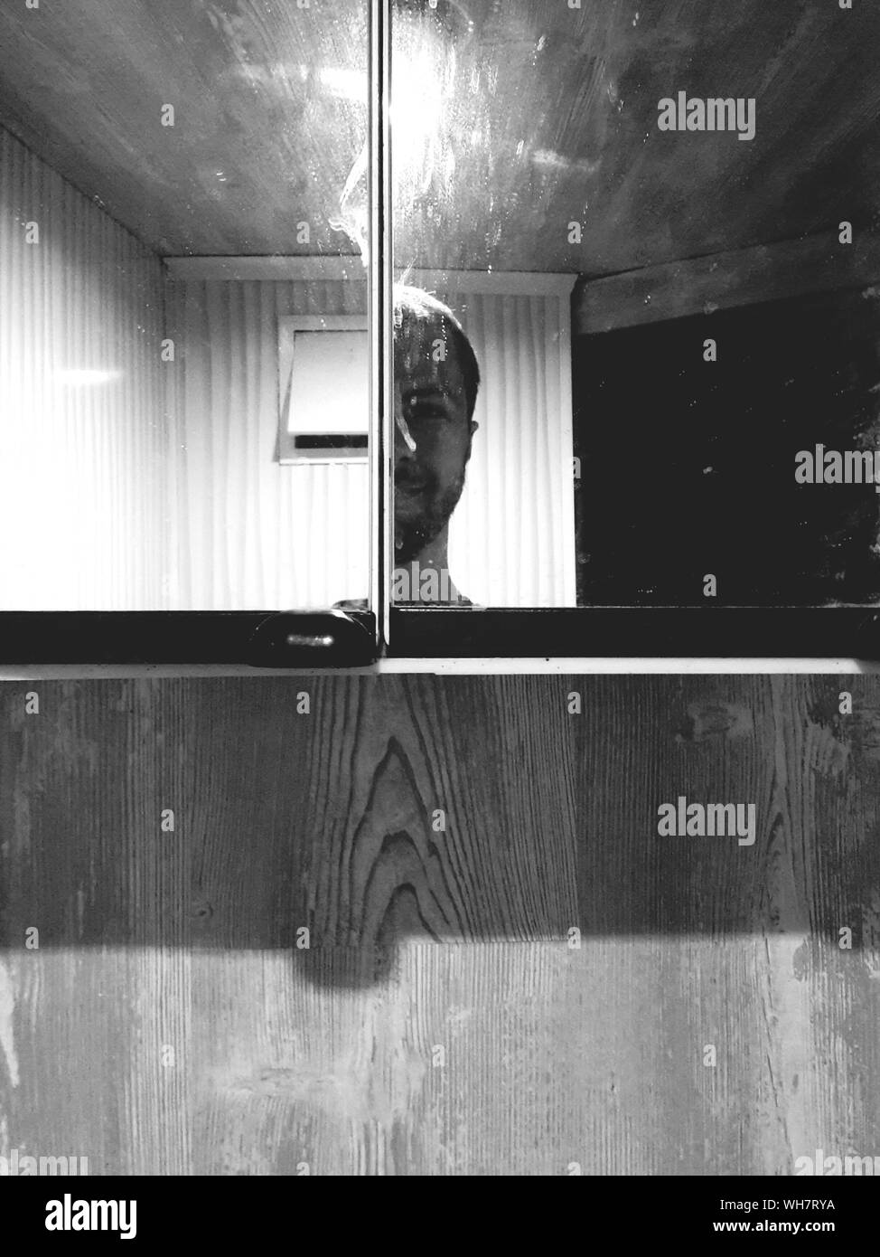 Young man reflection window Black and White Stock Photos & Images - Alamy