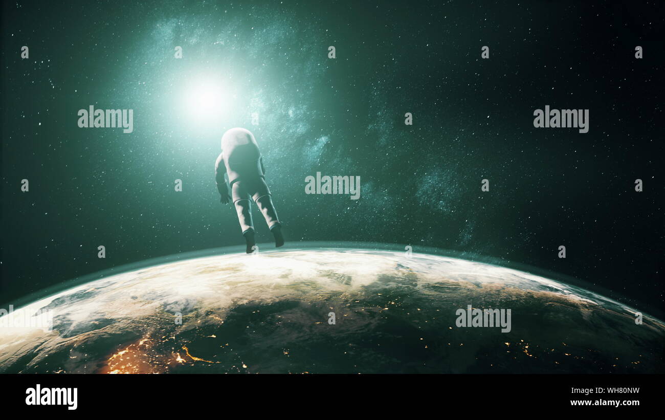 Astronaut in white spacesuit flies in outer space over illuminated ...
