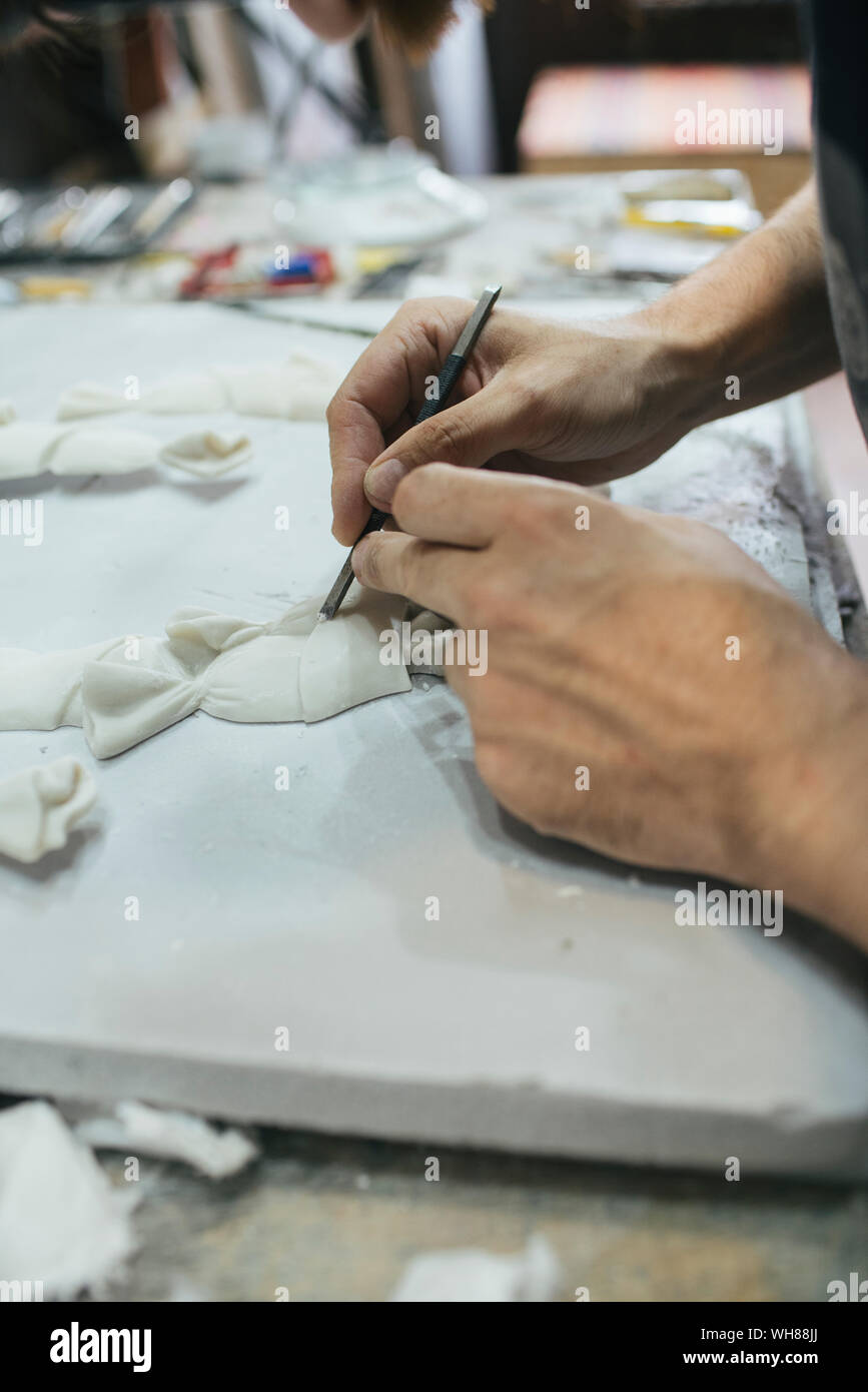 Sculptor working on an object Stock Photo - Alamy