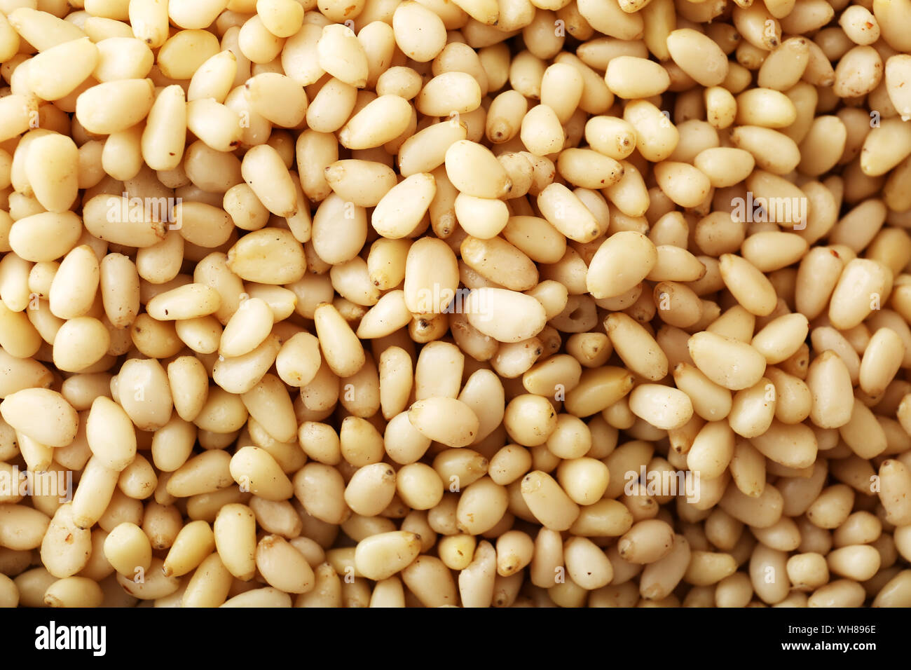 Background texture of shelled pine nuts Stock Photo - Alamy